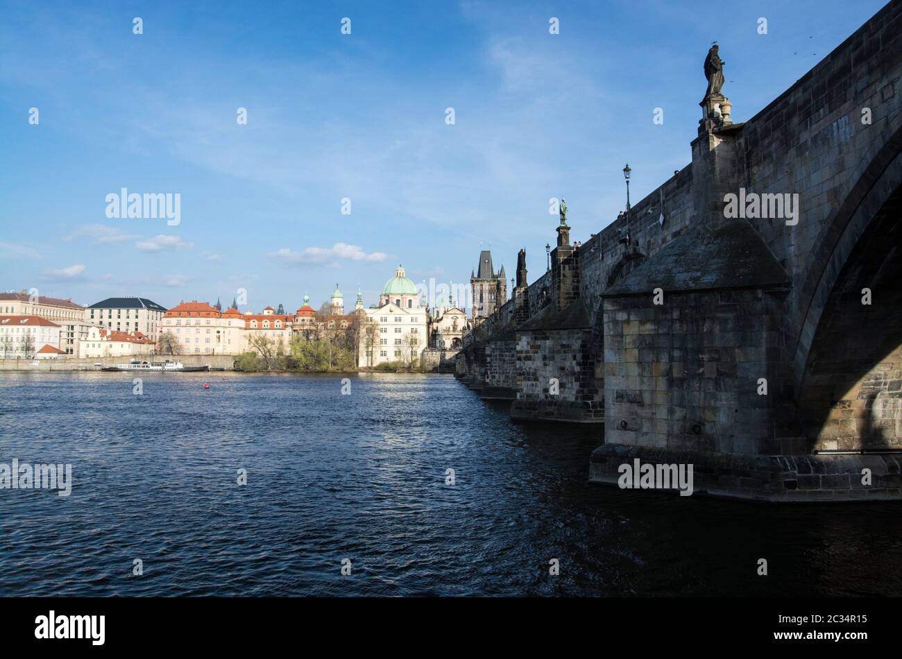 Charles Bridge is a historic bridge that crosses the Vltava river in ...