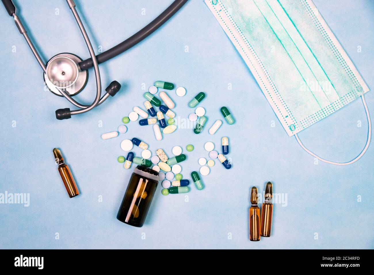 Flat-lay of medical equipment on blue background. Disease prevention ...