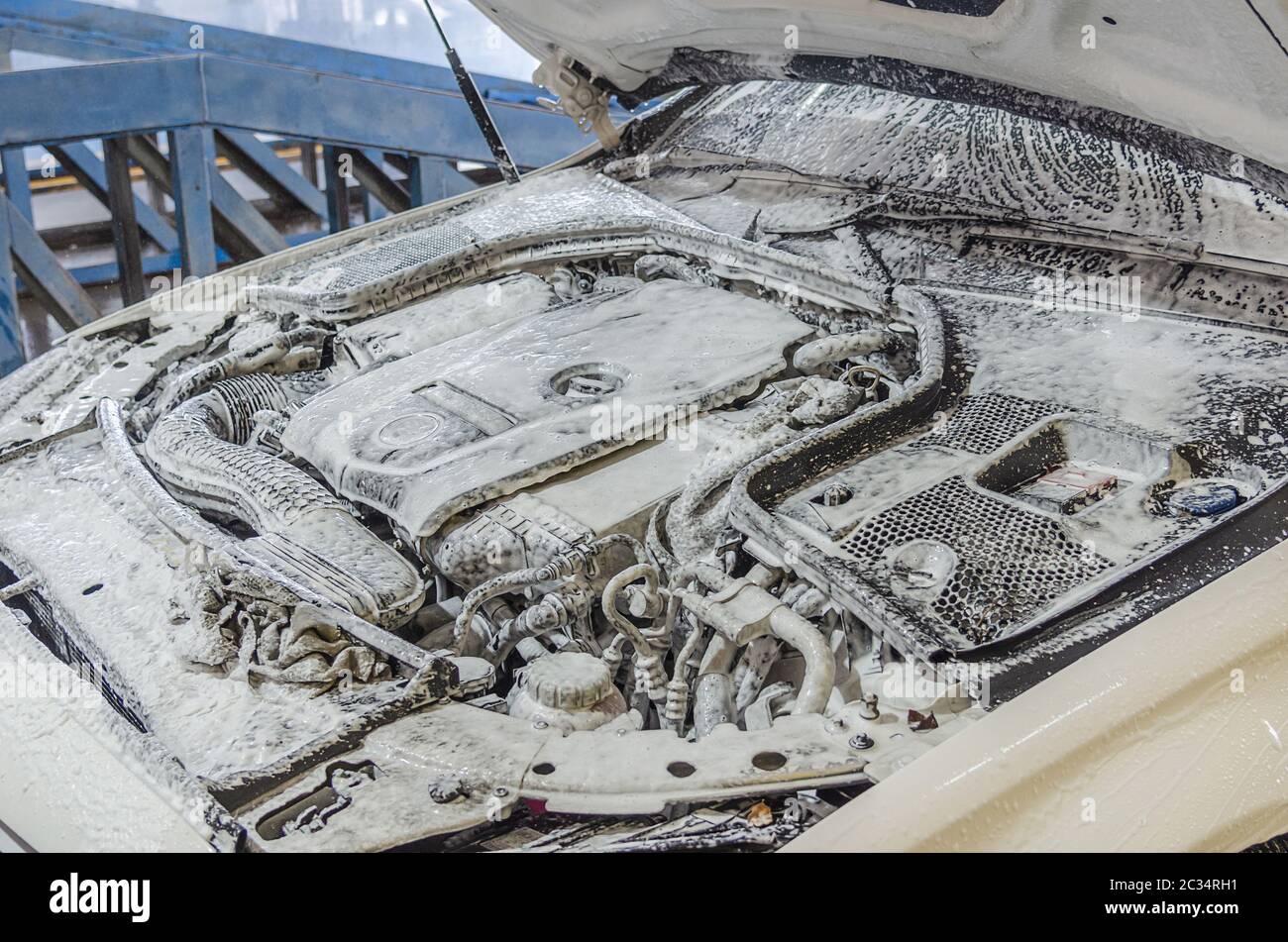 Wash the engine with car wash foam at the service station Stock Photo ...