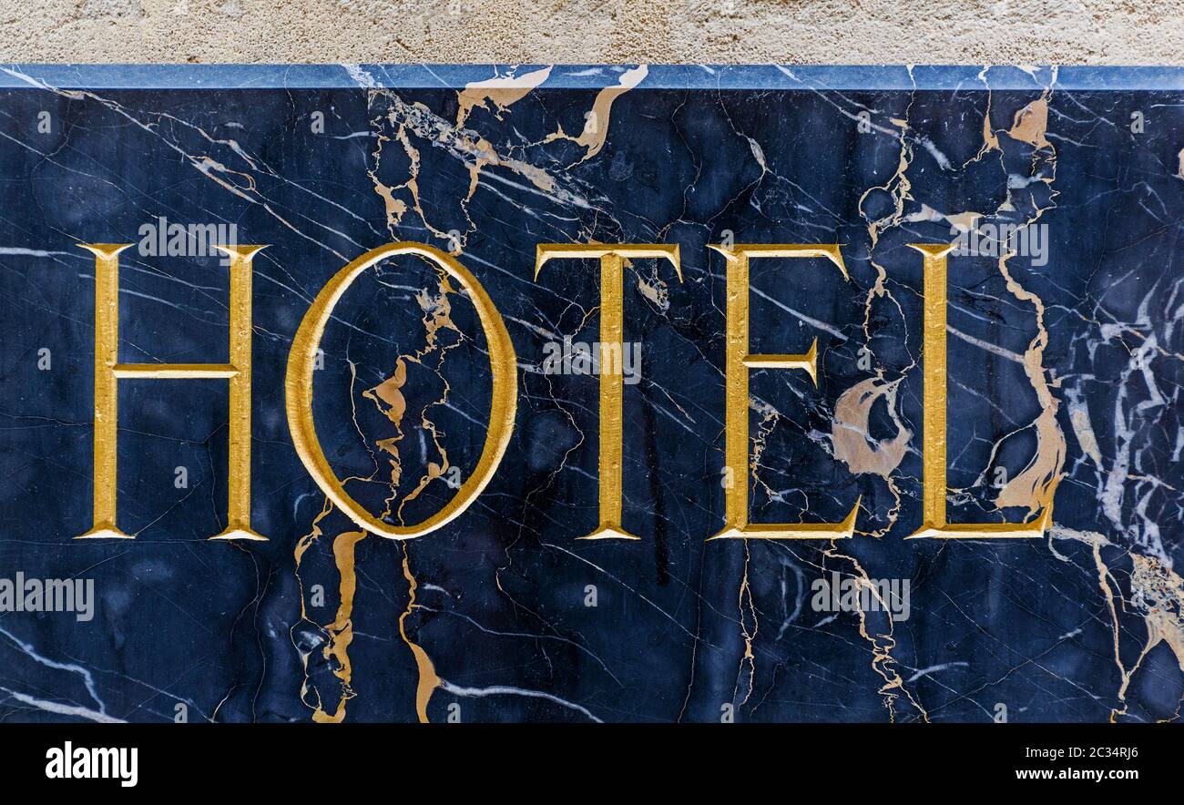 Golden Hotel Sign at Luxurious Marble Stone Stock Photo - Alamy