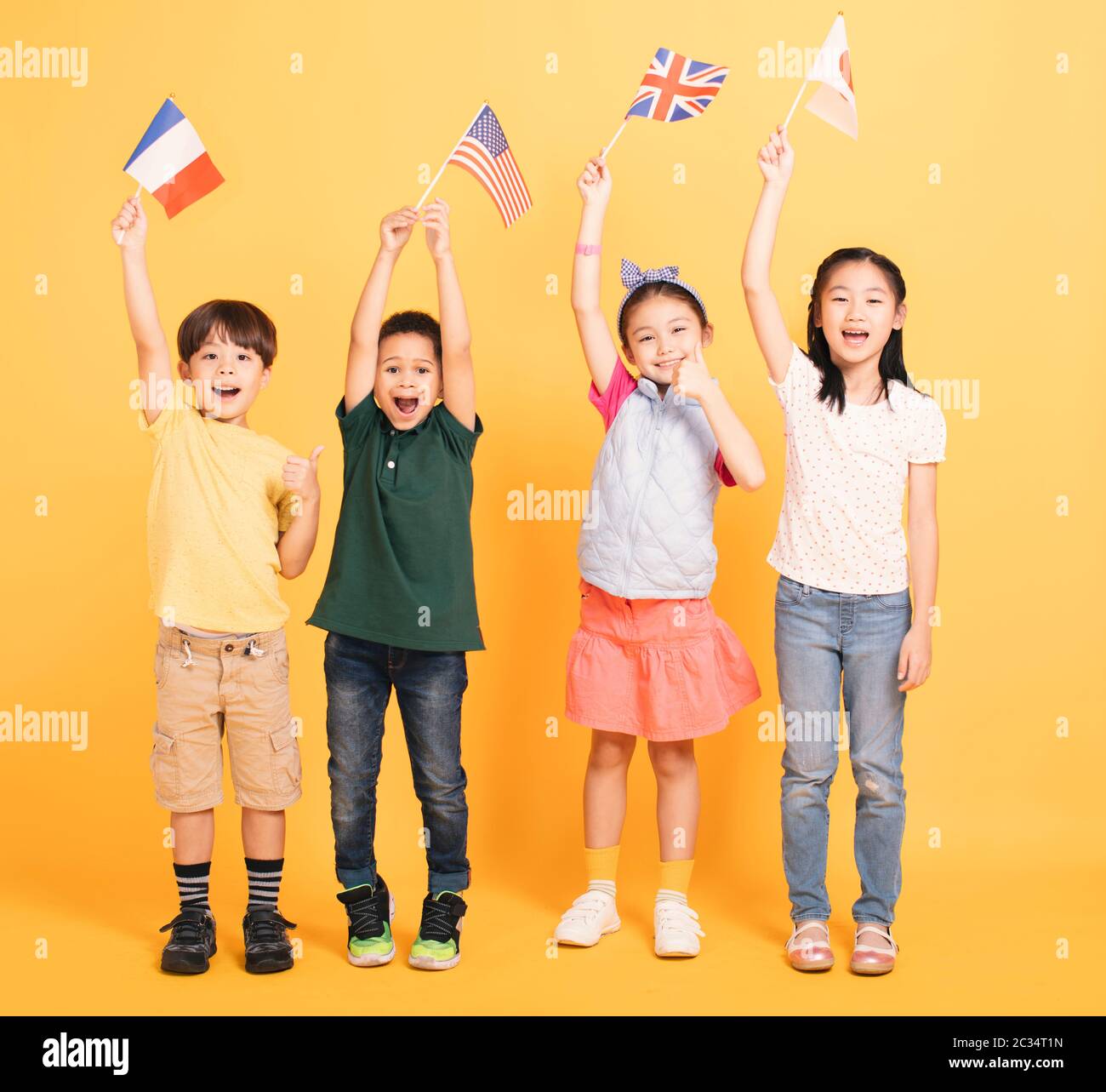 Group of happy kids showing the flags Stock Photo - Alamy