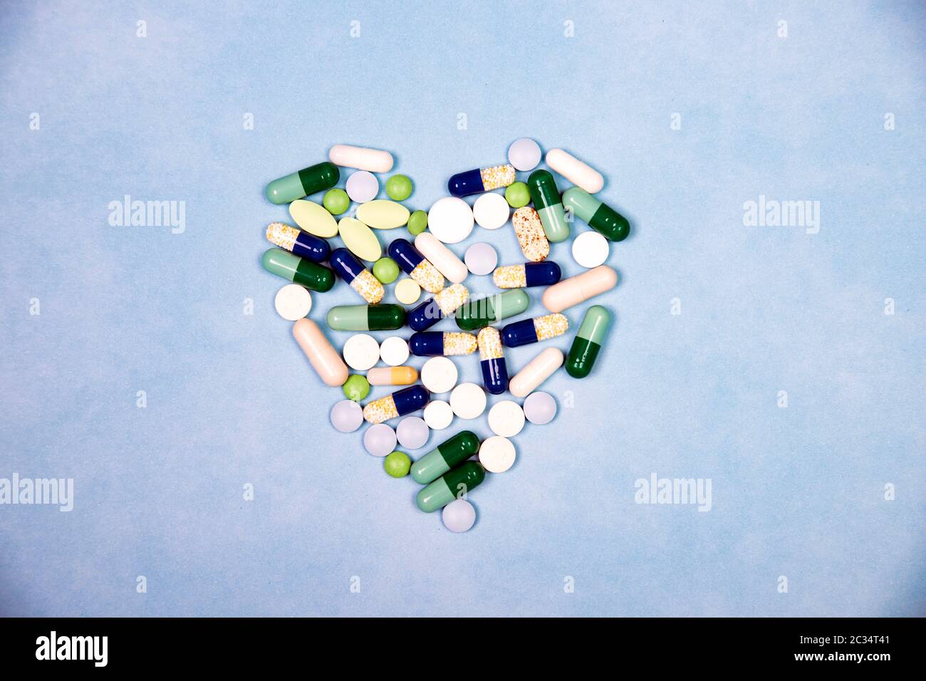 Close up group of drugs or medicines arrange in heart shape. Medical ...
