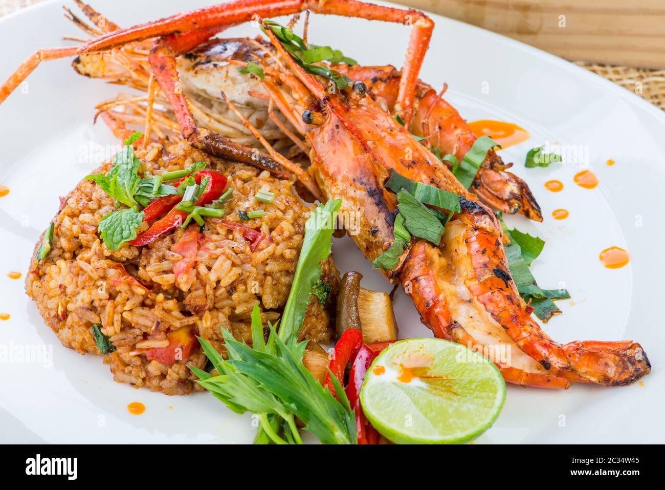 Asian fried rice with chicken, prawns, egg and vegetables, Thai cuisine ...