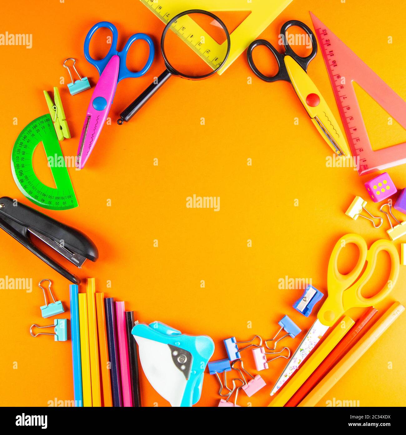 Background texture: school stationery on the orange desk. Stationery ...