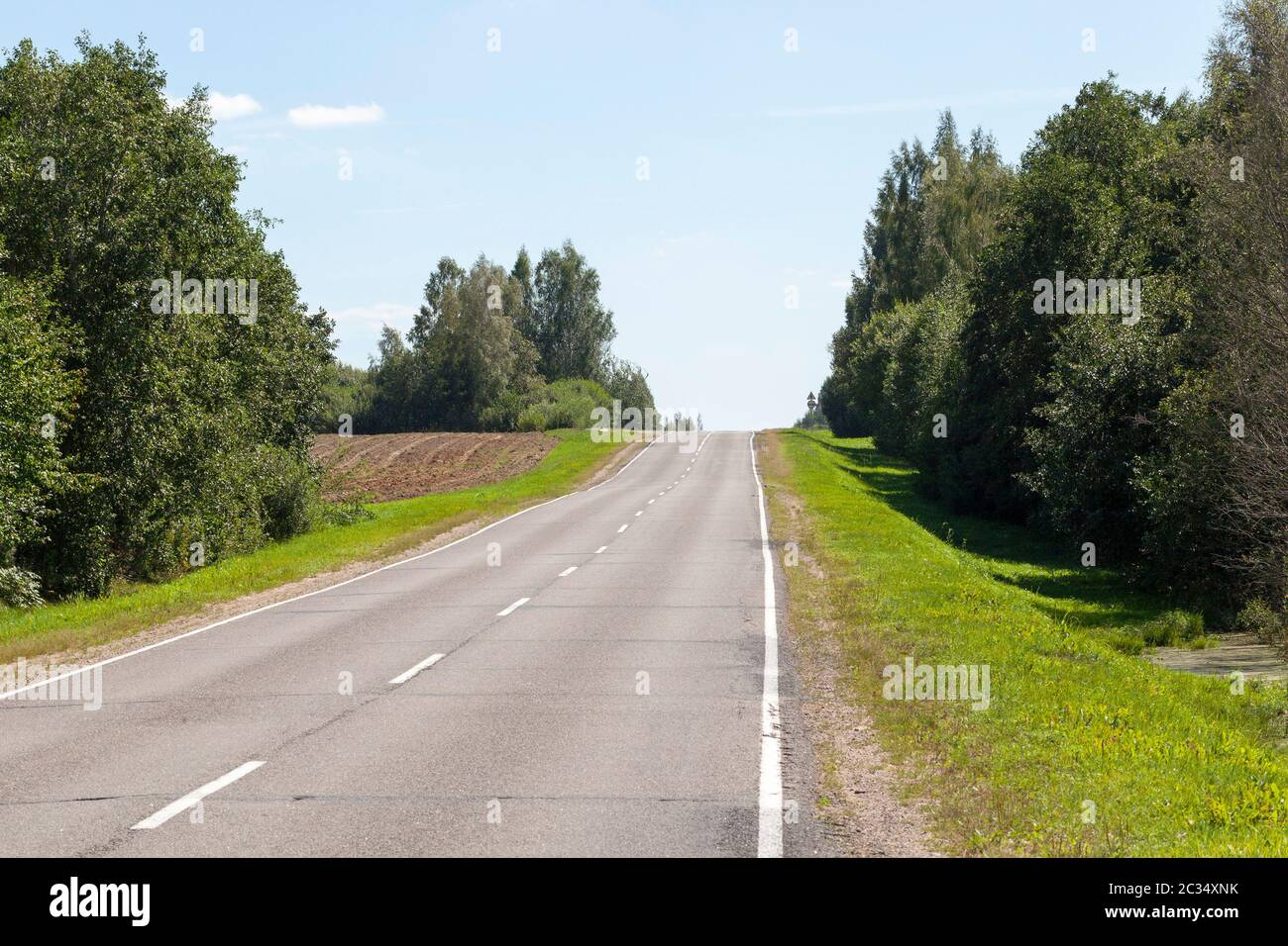 the unpopular narrow paved road in the provincial area Stock Photo - Alamy
