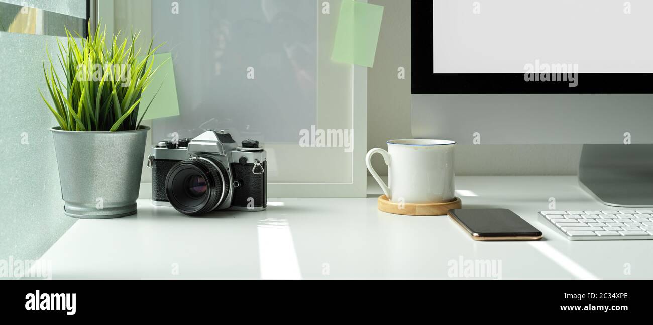 Close up view of modern office desk with computer device, smartphone ...