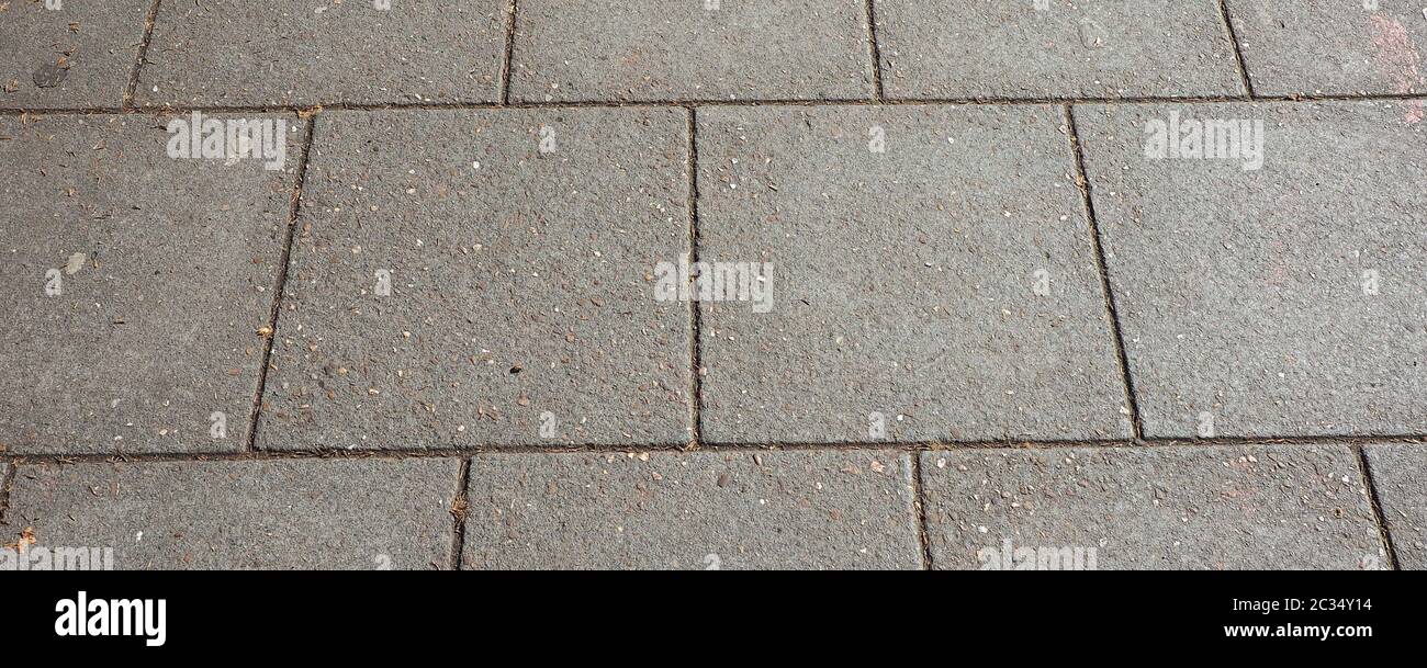 wide A concrete pavement sidewalk path for pedestrians Stock Photo - Alamy