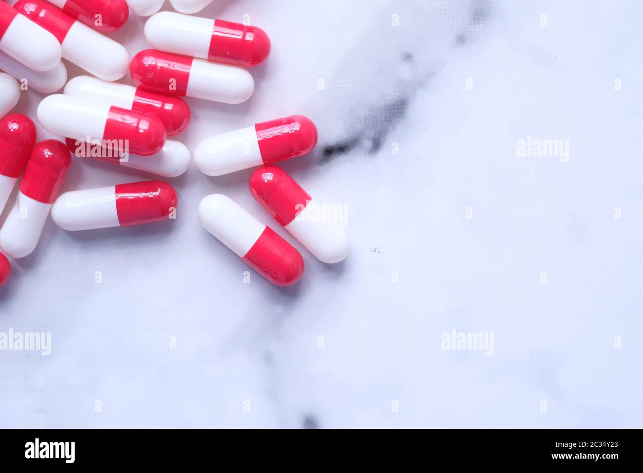 close up of colorful capsules on white background Stock Photo - Alamy