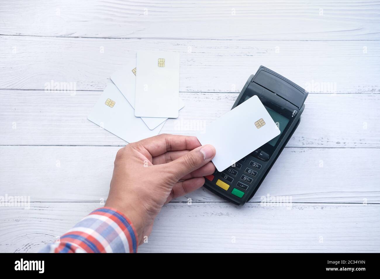 Payment terminal charging from a card, contactless payment Stock Photo ...