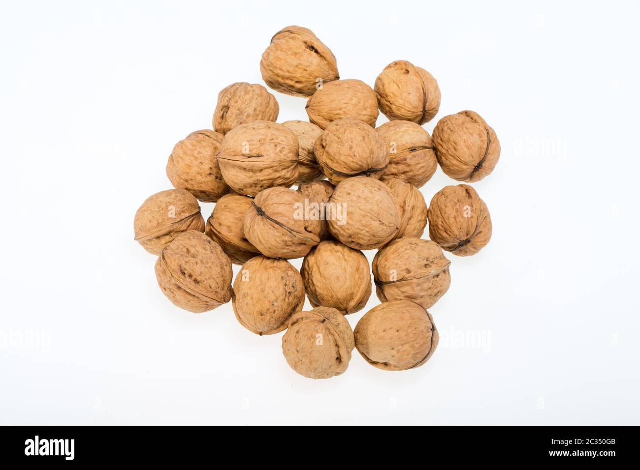 walnuts heap isolated on white background Stock Photo - Alamy