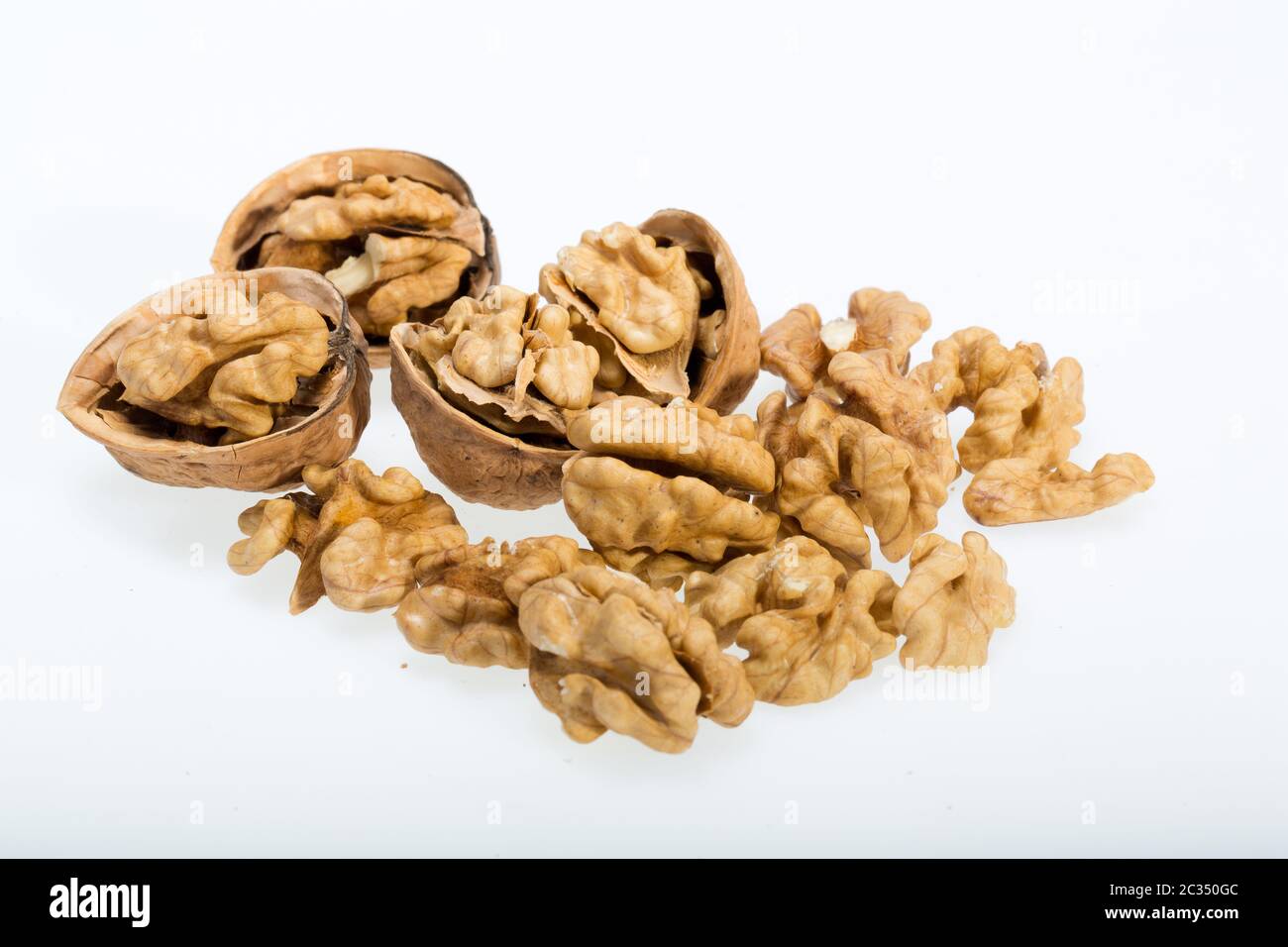 cracked walnut isolated on the white background Stock Photo - Alamy