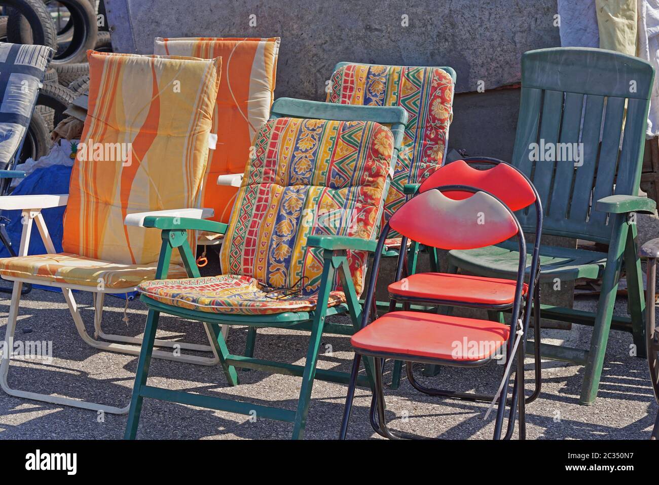 Various colors and shapes of garden chairs furniture Stock Photo - Alamy