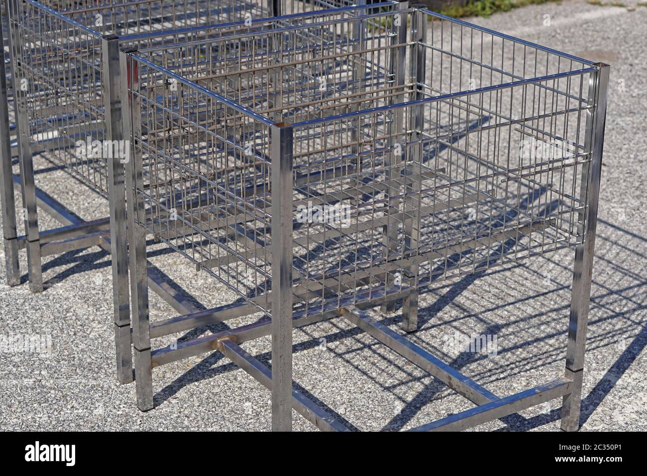 Mobile wire island shelving units for shops Stock Photo - Alamy