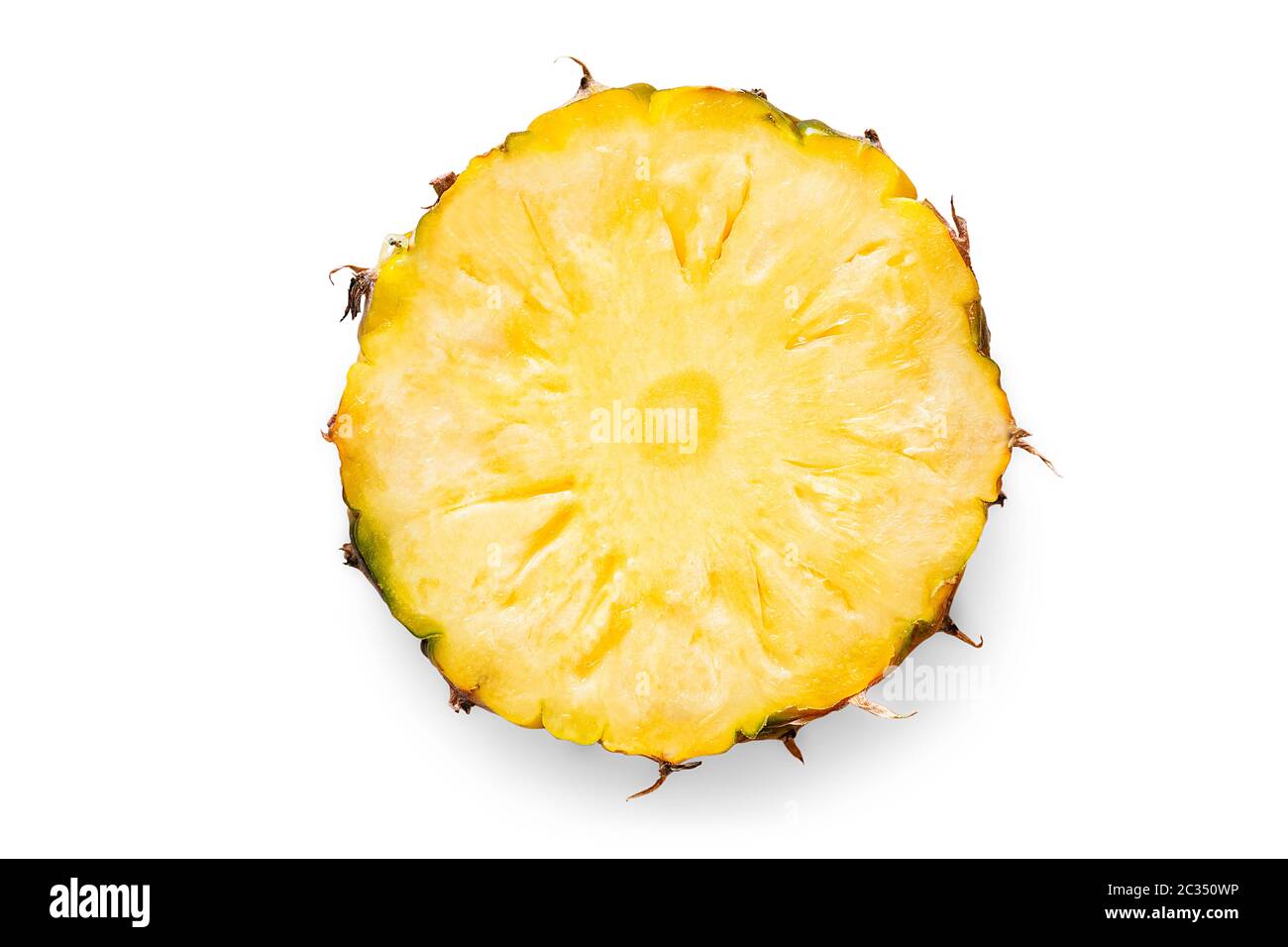 Organic ripe pineapple in a piece of cross section cut or round shape ...