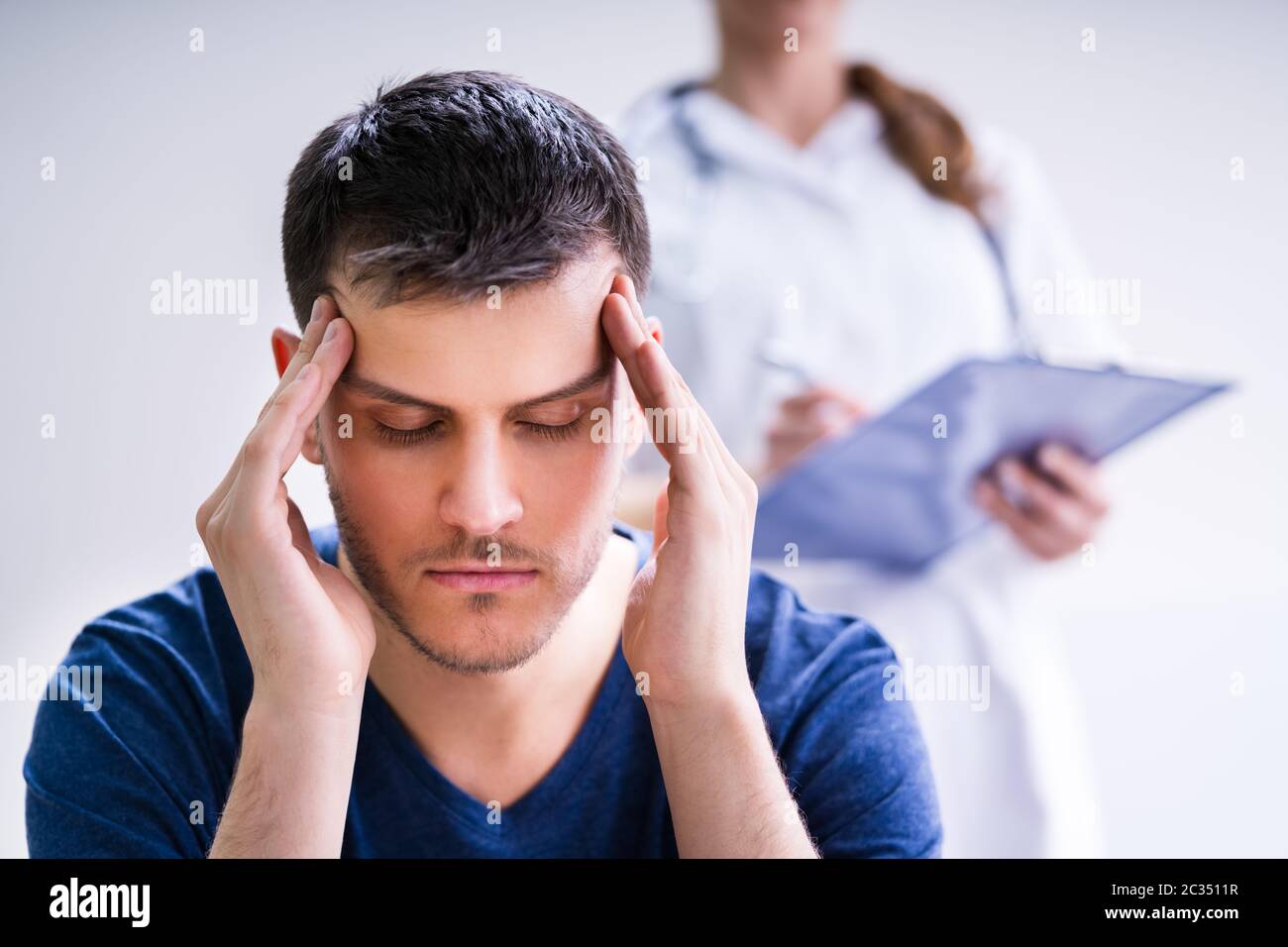 Male Patient With Headache In A Clinic Stock Photo - Alamy