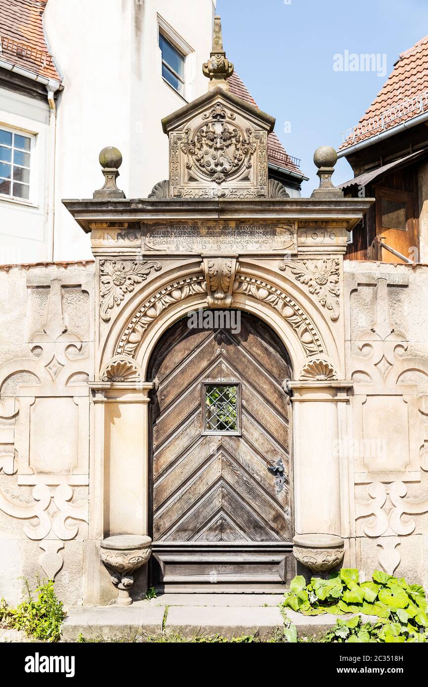 Historical entrance portal from 1616 with an inscription. Richly ...