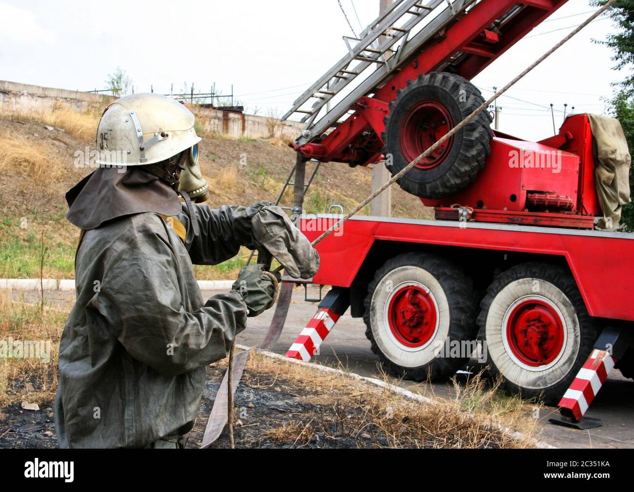 fireman wearing a gas mask on the stairs Stock Photo - Alamy