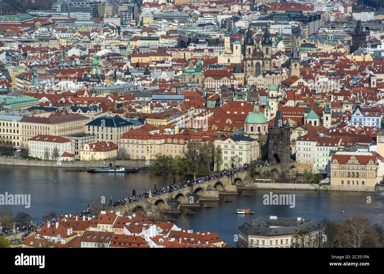 Charles Bridge is a historic bridge that crosses the Vltava river in ...
