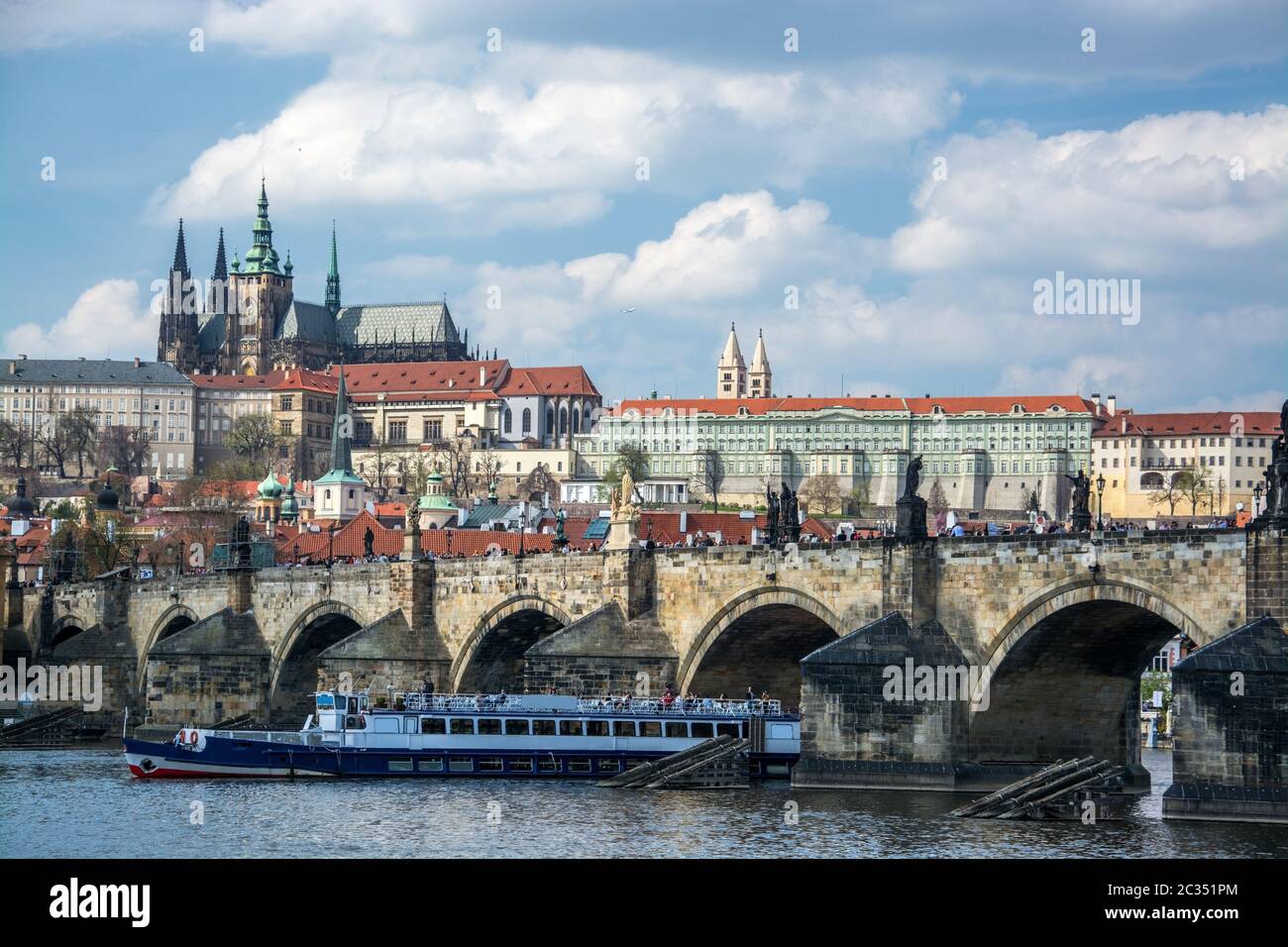 Charles Bridge is a historic bridge that crosses the Vltava river in ...