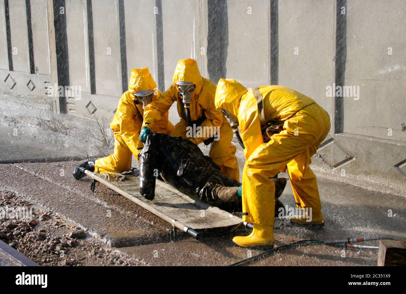 Worker in yellow protective suit hi-res stock photography and images ...