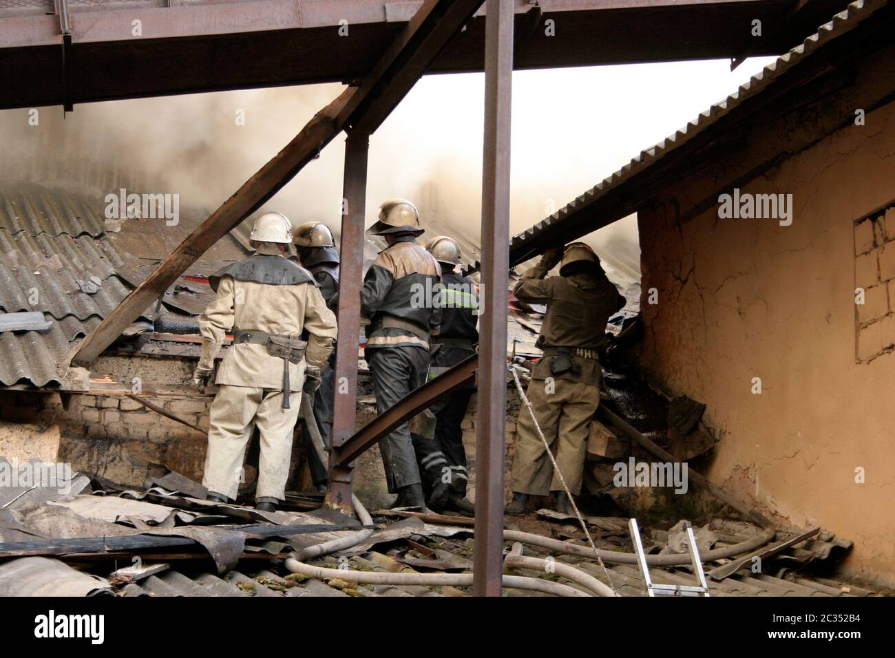 fireman spraying water Stock Photo - Alamy