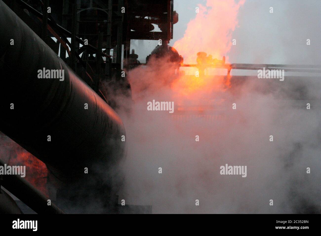 Pipeline fire and smokestack Stock Photo - Alamy