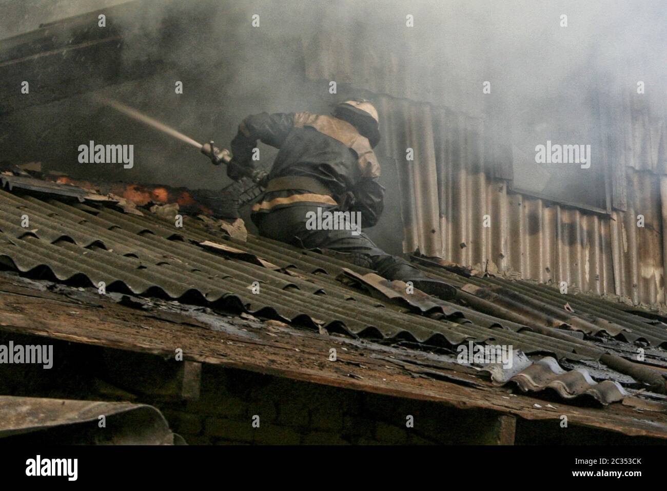 ireman spraying water Stock Photo - Alamy