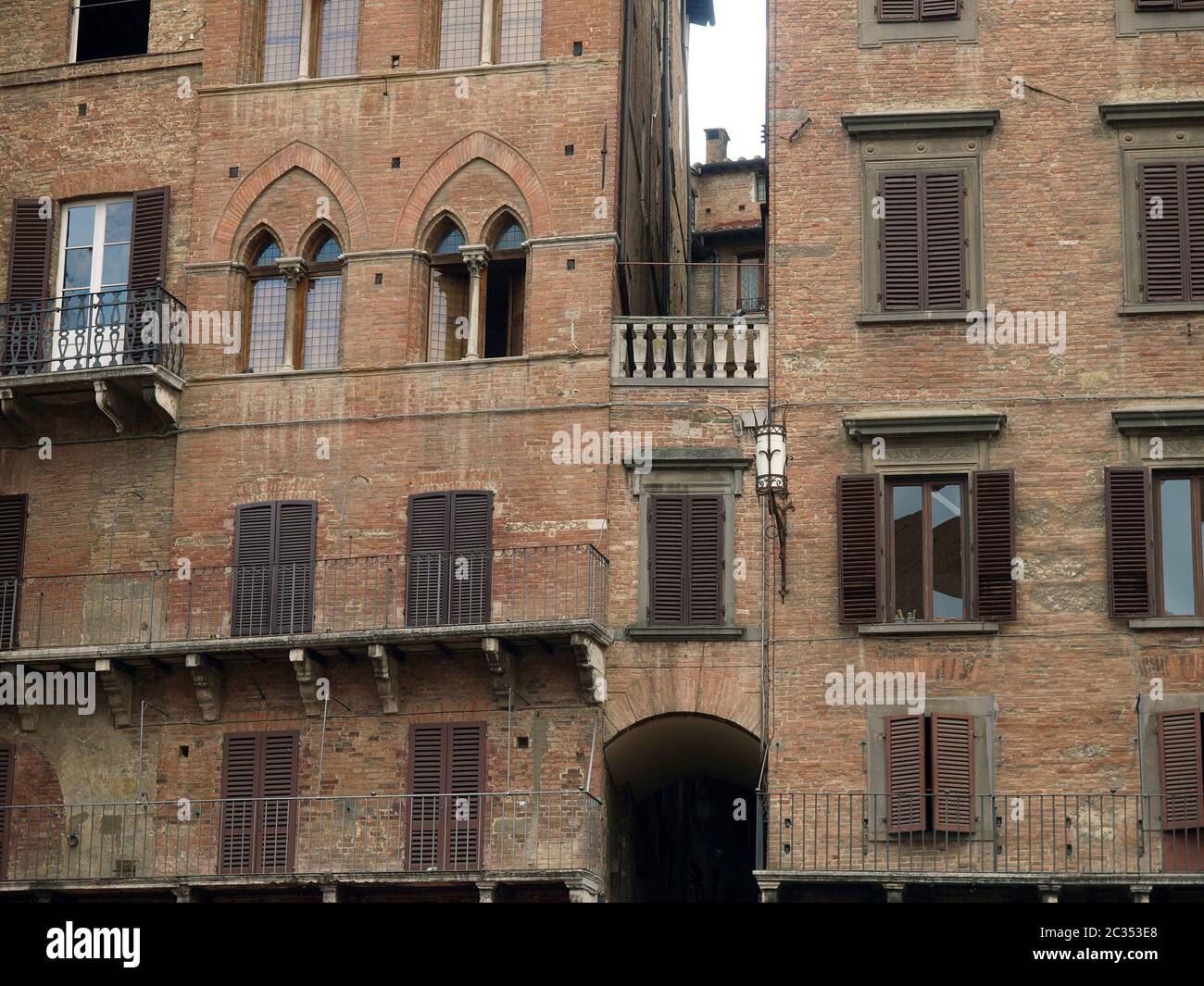 Siena - brick facades of Gothic buildings at Piazza Del Campo Stock ...