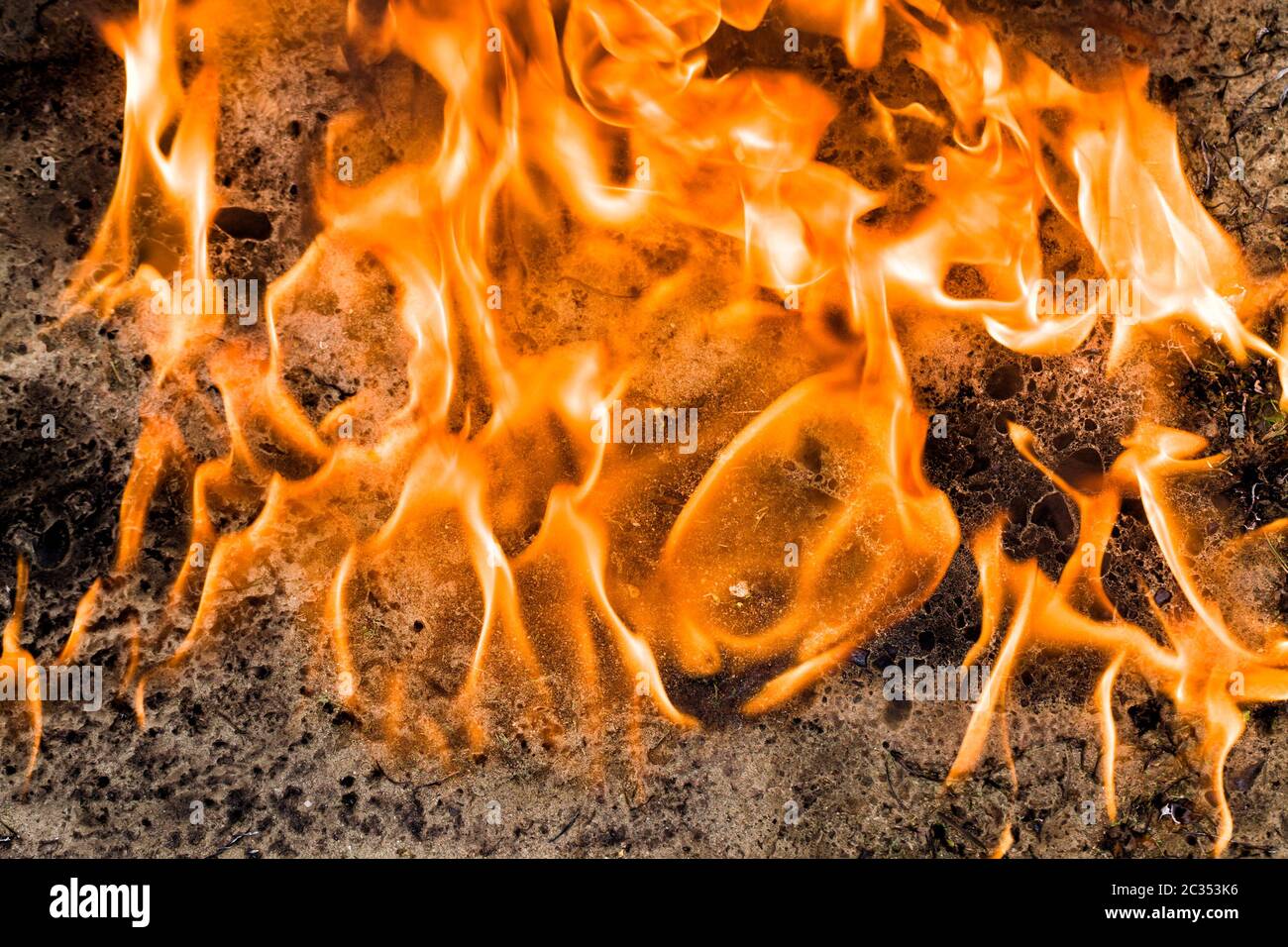 dangerous smoke and orange bright and hot flames from the fire in which ...