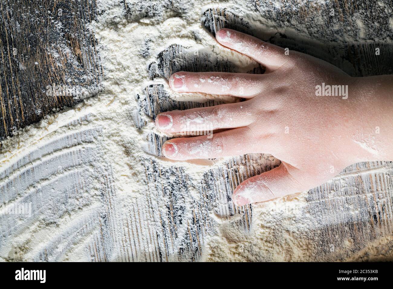 traces of the child hand on a large amount of flour after cooking real ...