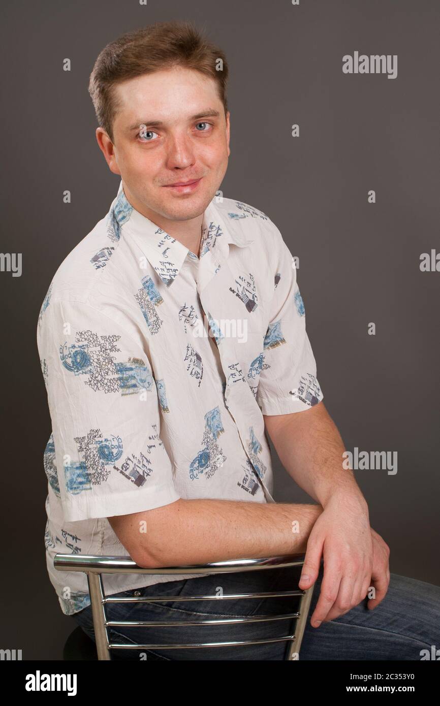 man posing in white shirt Stock Photo - Alamy