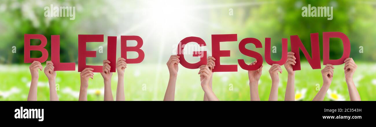 People Hands Holding Colorful German Word Bleib Gesund Means Stay ...