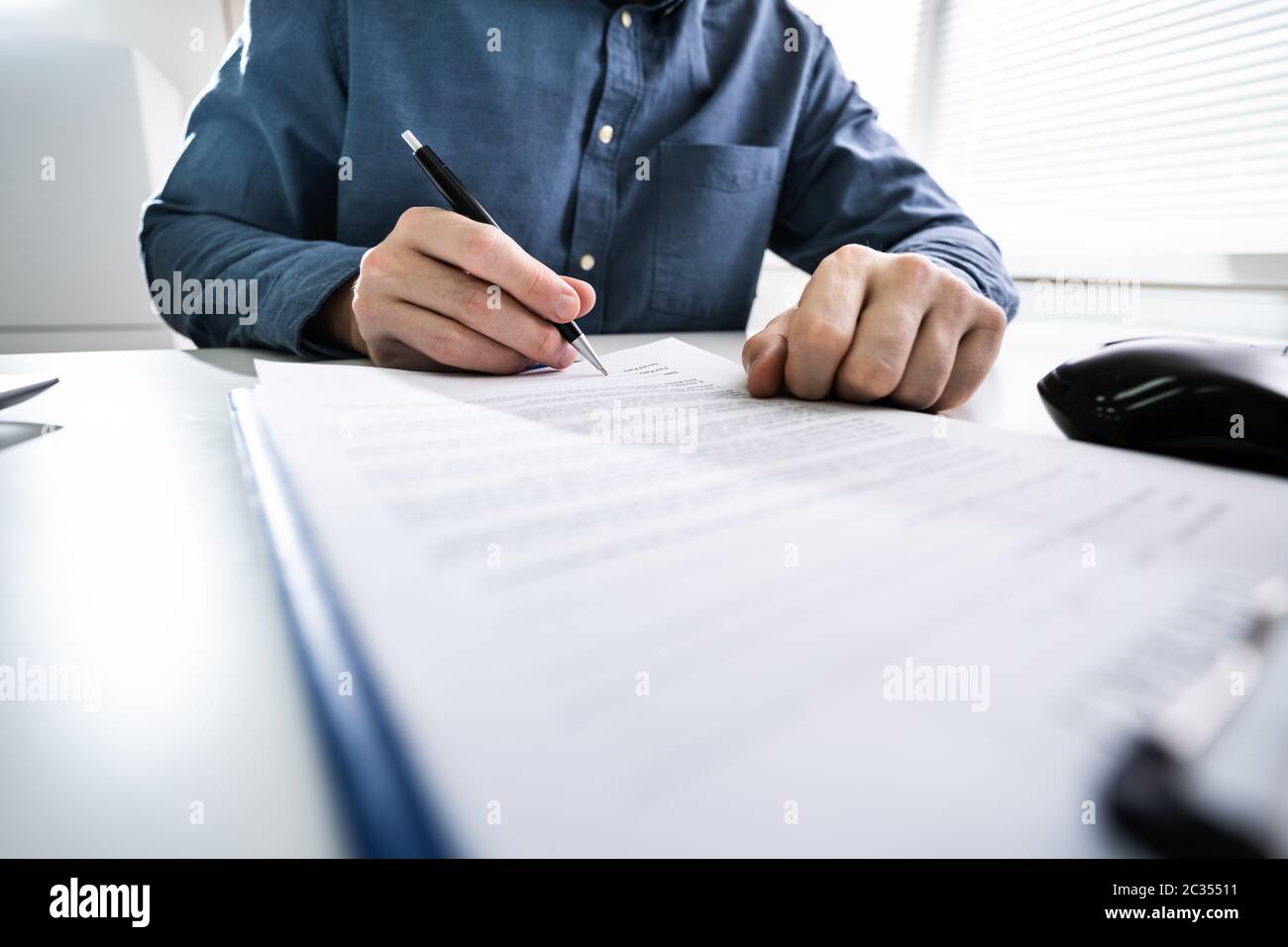 Lawyer Signing Legal Form Paper Or Letter Stock Photo - Alamy