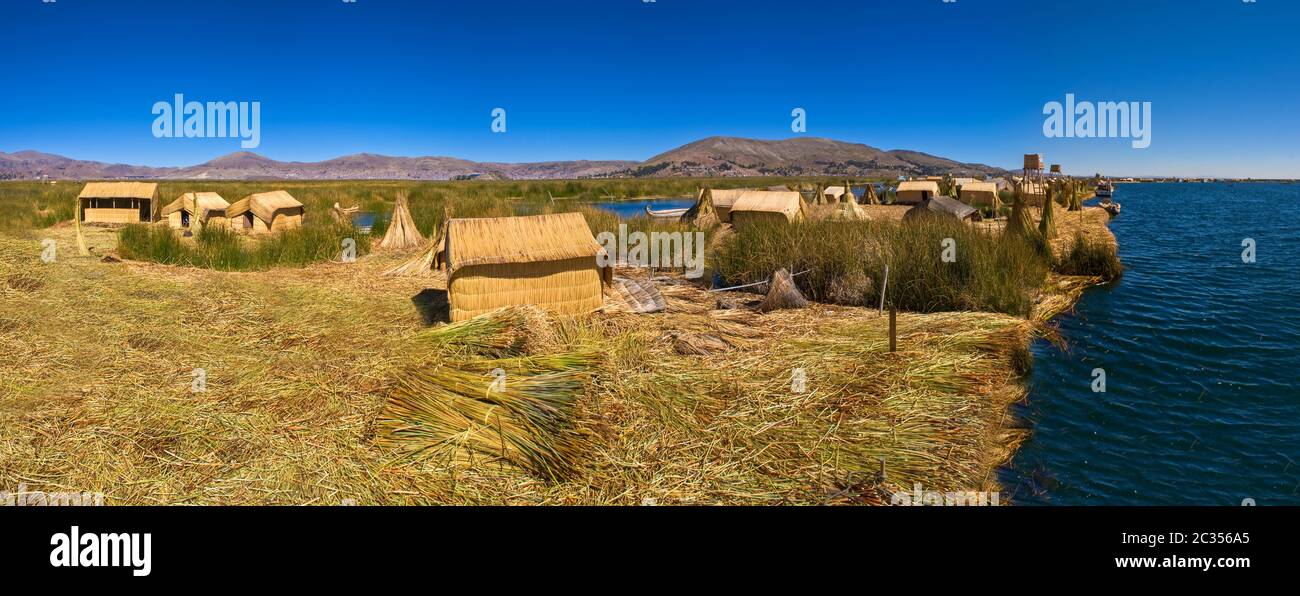 Titicaca lake Peru Uro huts on floating island PANORAMA Stock Photo - Alamy