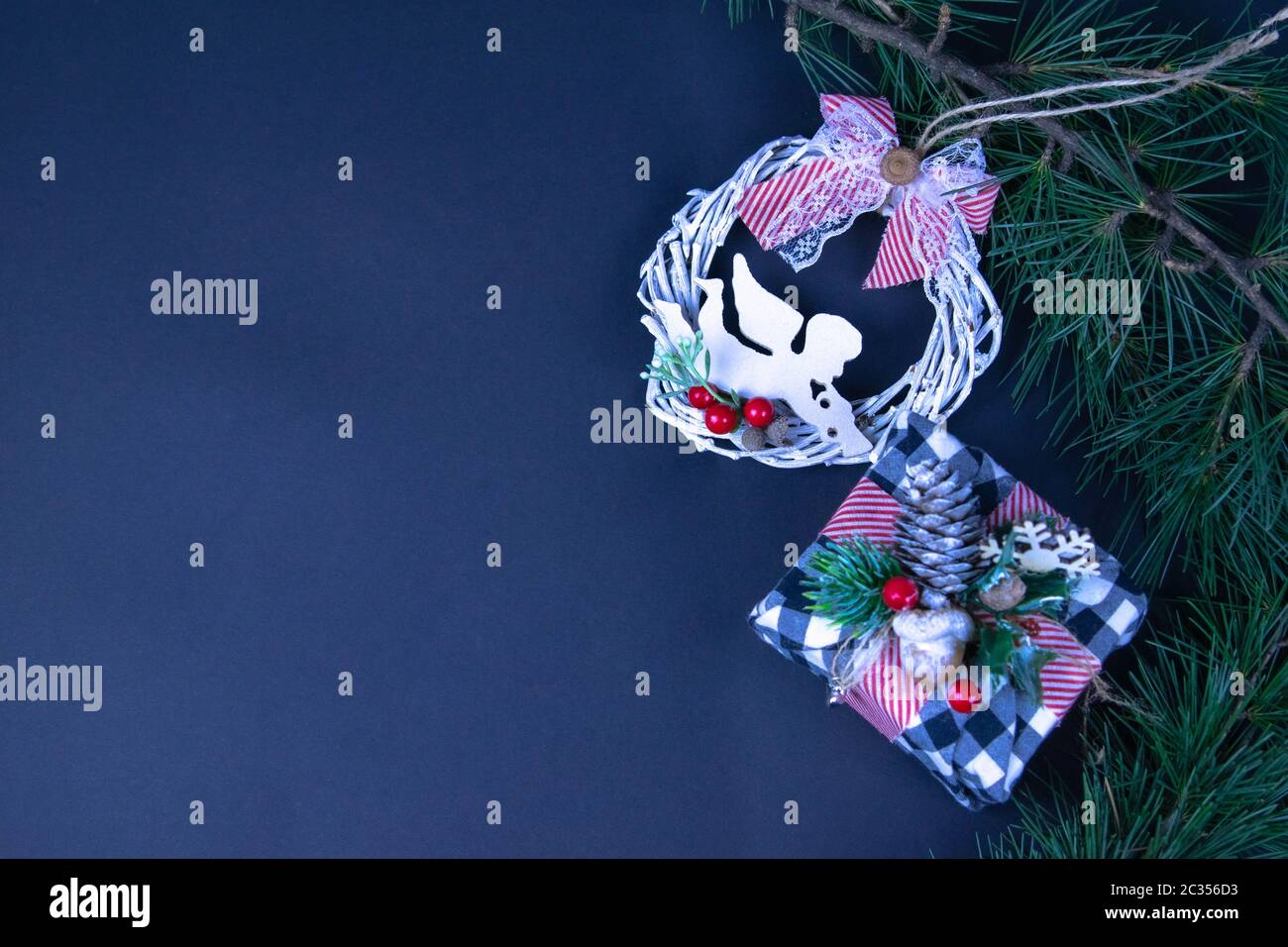 Christmas background with an angel and a gift, area for text is ...