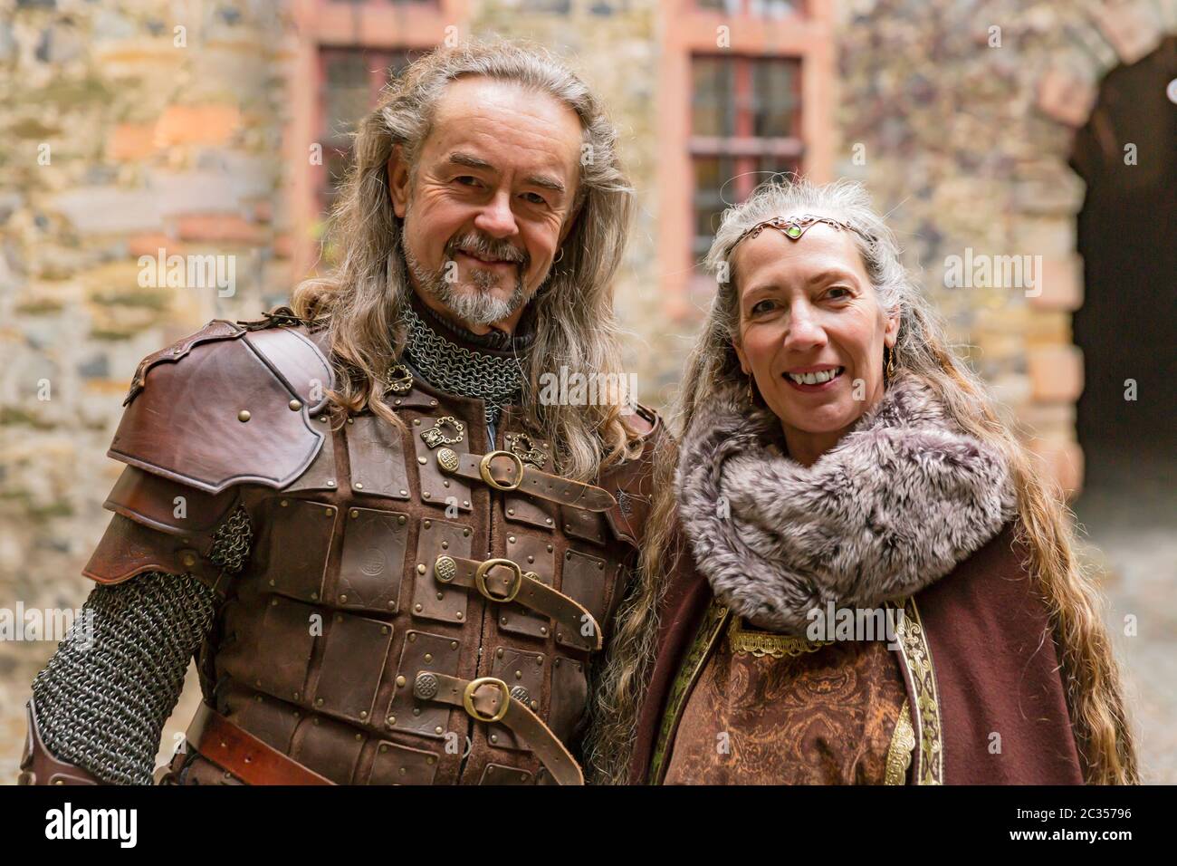 Couple posing robed in beautiful medieval clothing Stock Photo - Alamy