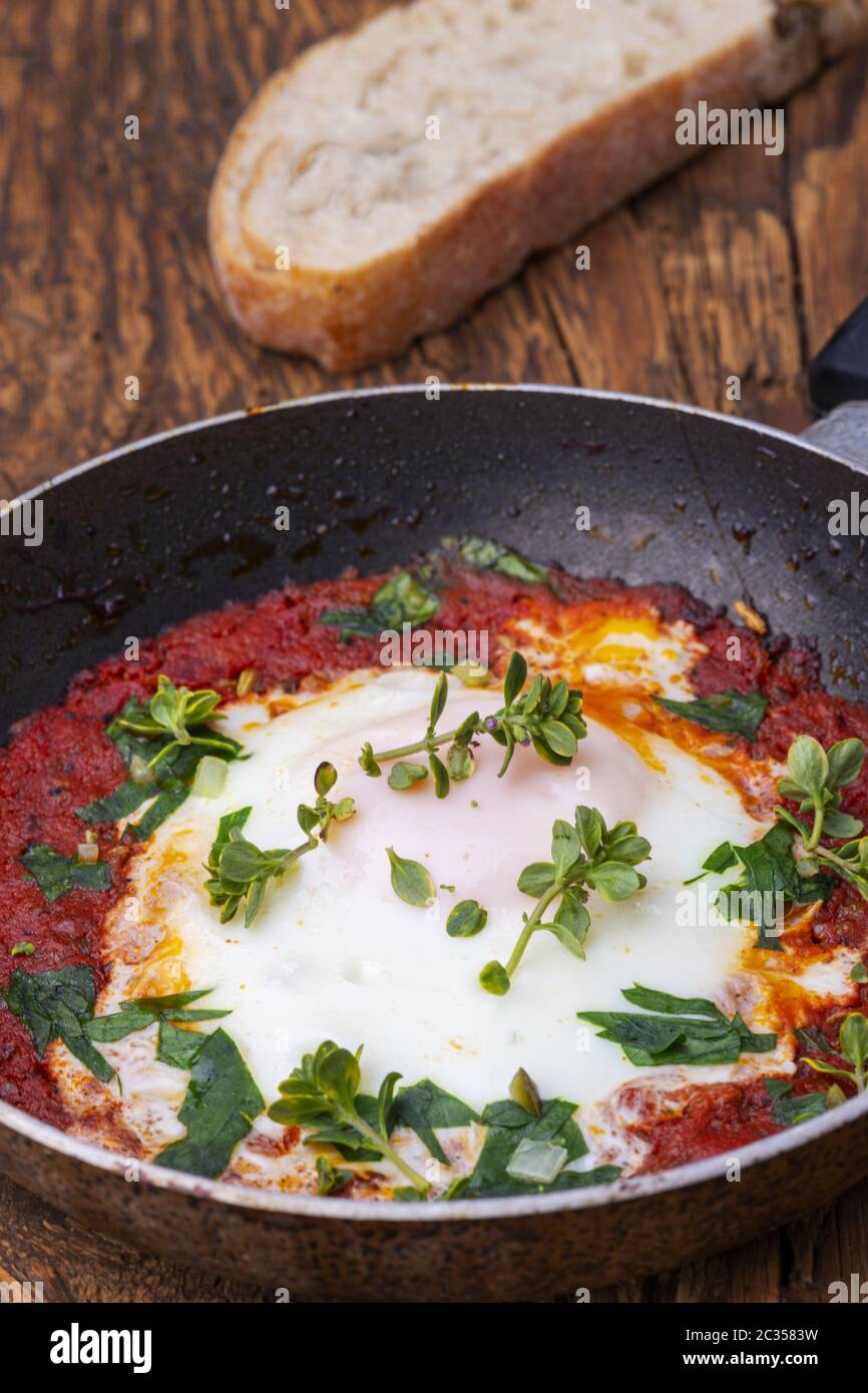 Pan shakshuka on table hi-res stock photography and images - Alamy