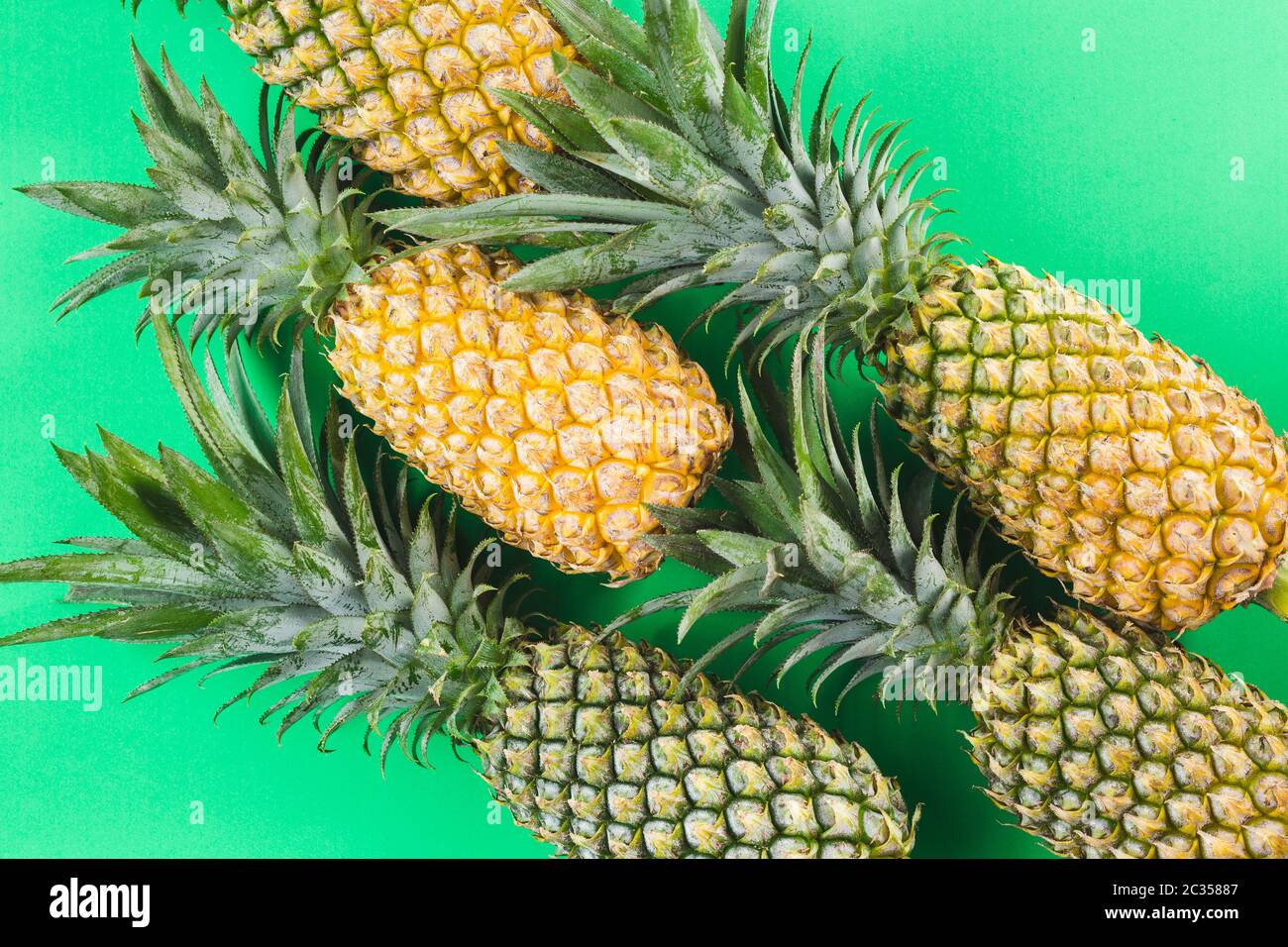 Fresh pineapple on the colorful background Stock Photo - Alamy