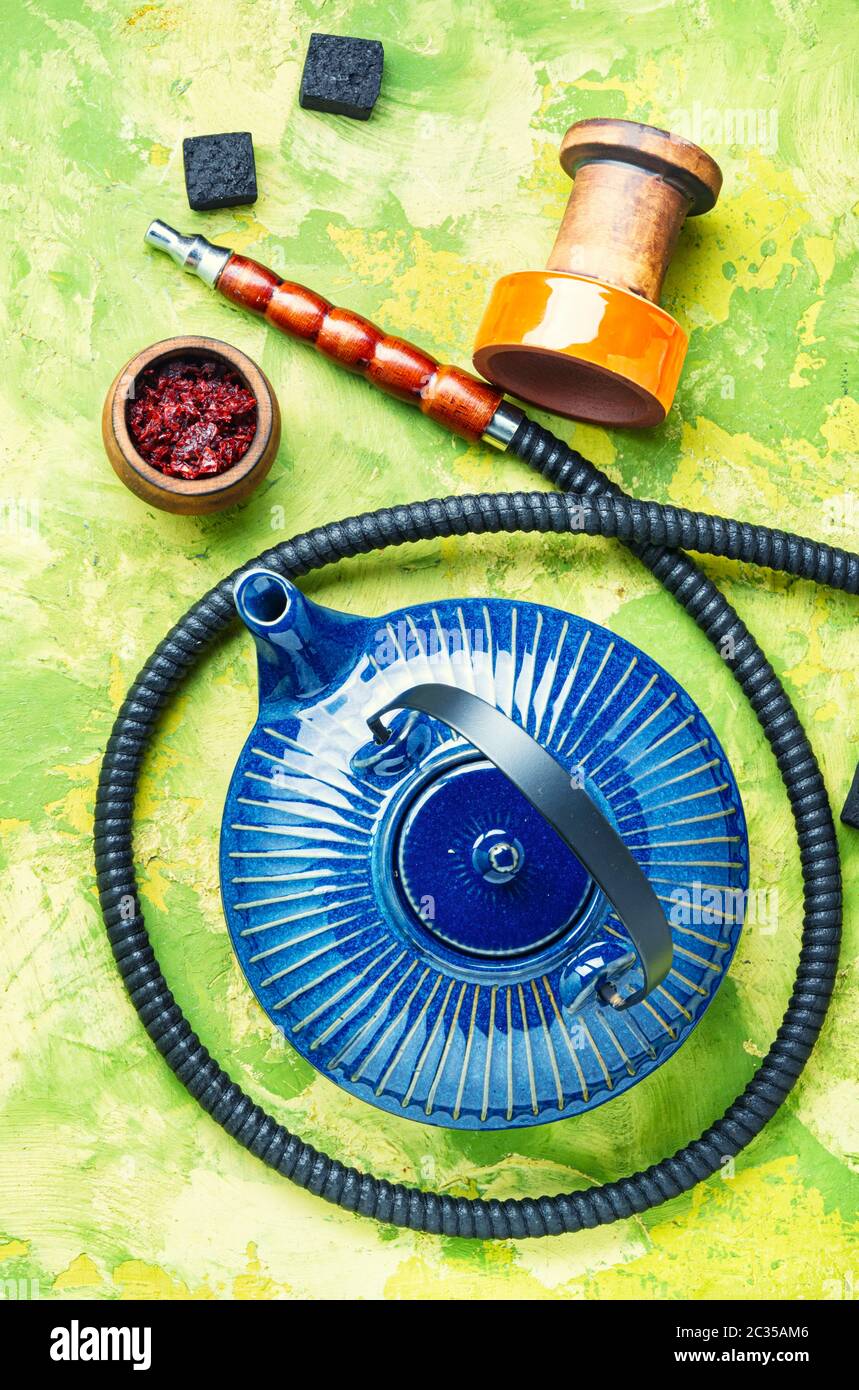 Details of tobacco hookah and teapot with tea.Egyptian smoking shisha ...