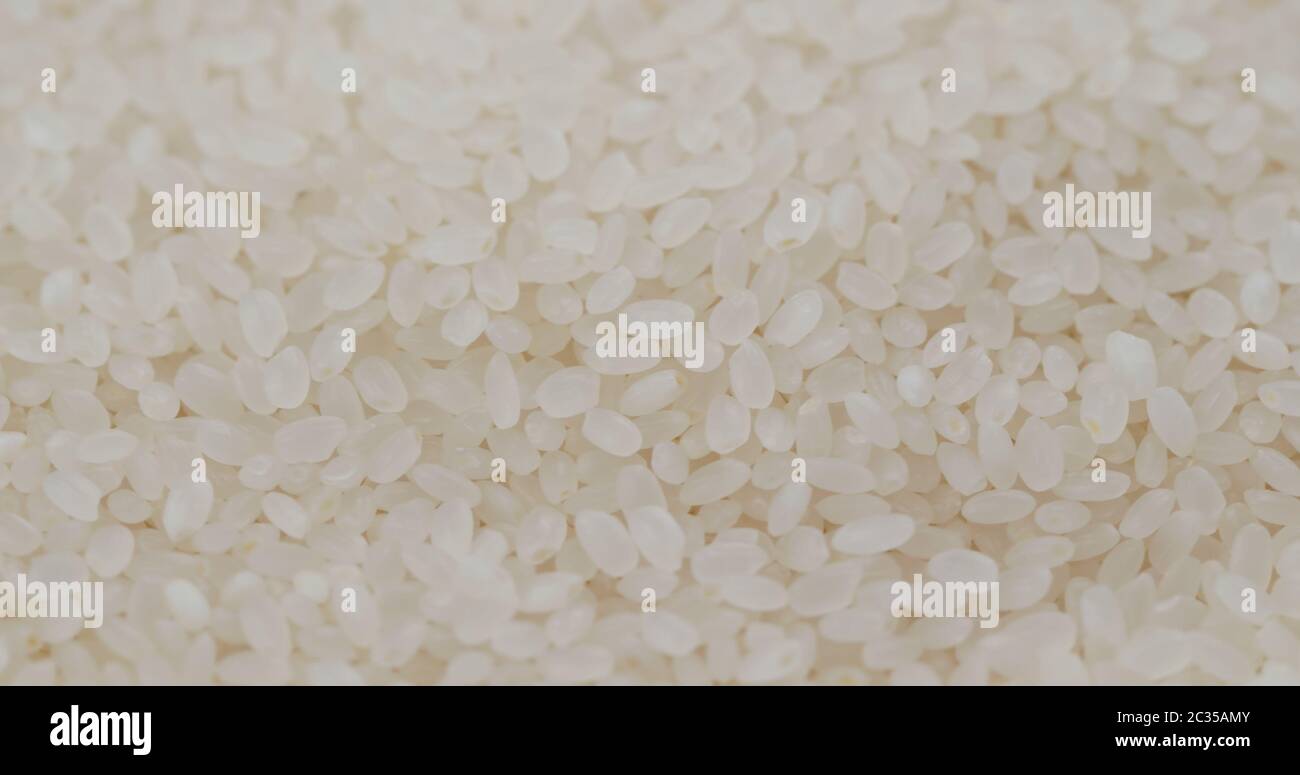 Pile of Rice dried and uncooked Stock Photo - Alamy