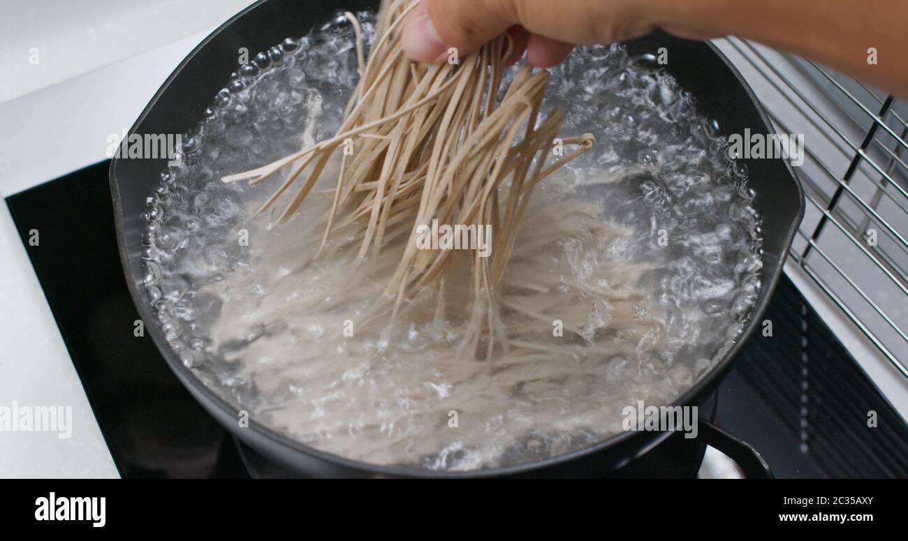 Cooking soba in the kitchen Stock Photo - Alamy