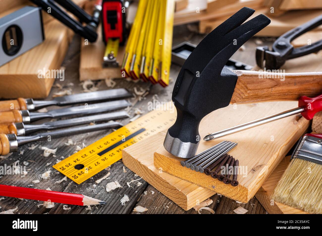 Close-up of carpenter's tools on an antique wooden table. Construction ...