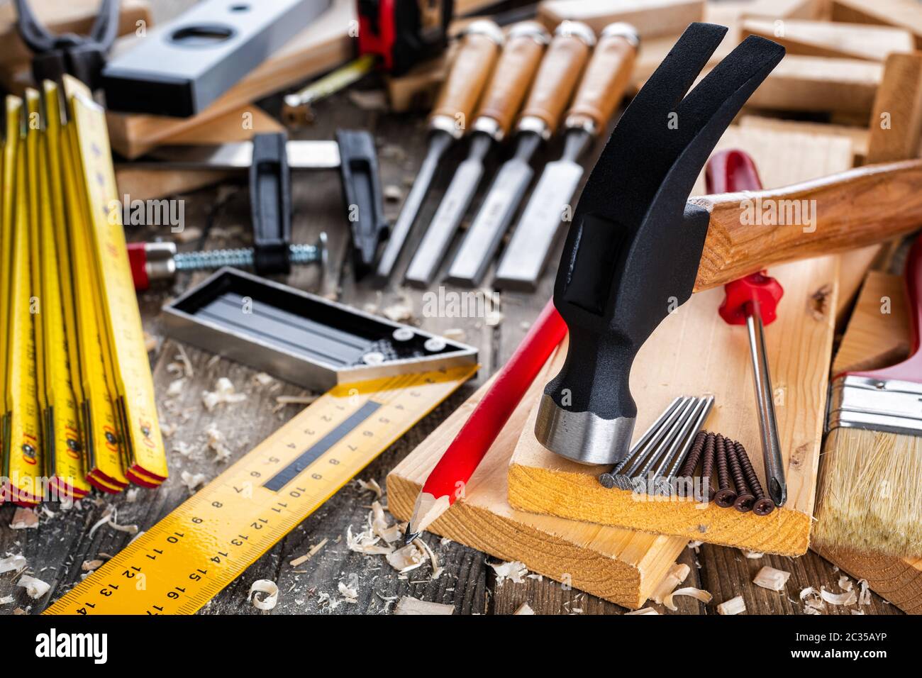 Close-up of carpenter's tools on an antique wooden table. Construction ...