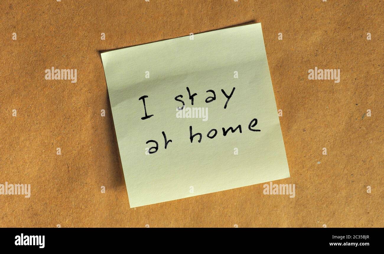I stay at home written on sticky note Stock Photo - Alamy