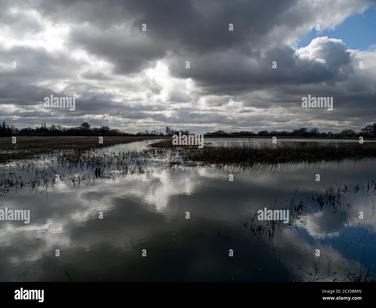 Dramatic cloudy sky over the flooded wetlands at Wheldrake Ings Nature ...