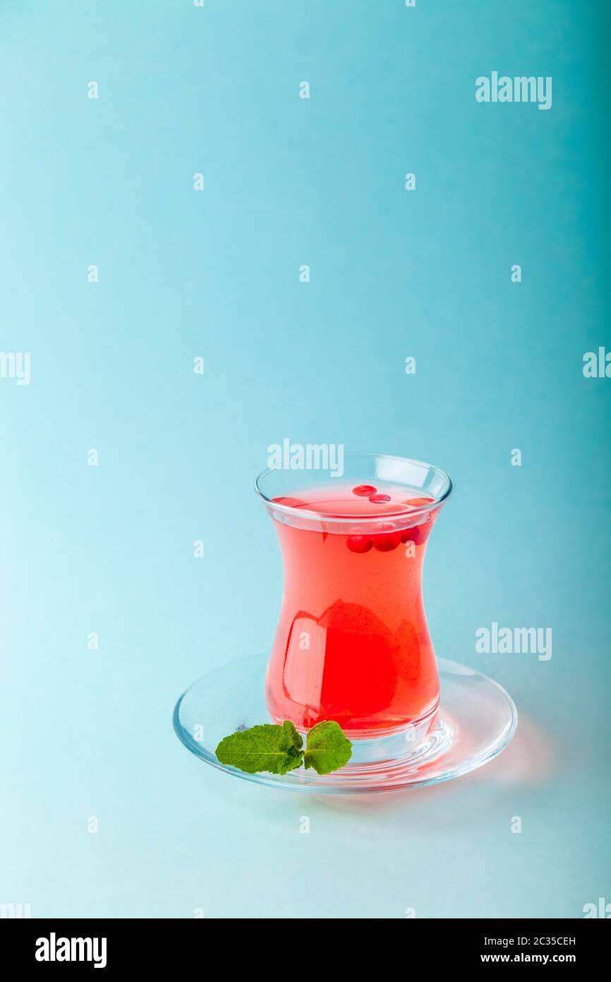 Fresh fruit red tea in transparent turkish teacup Stock Photo - Alamy