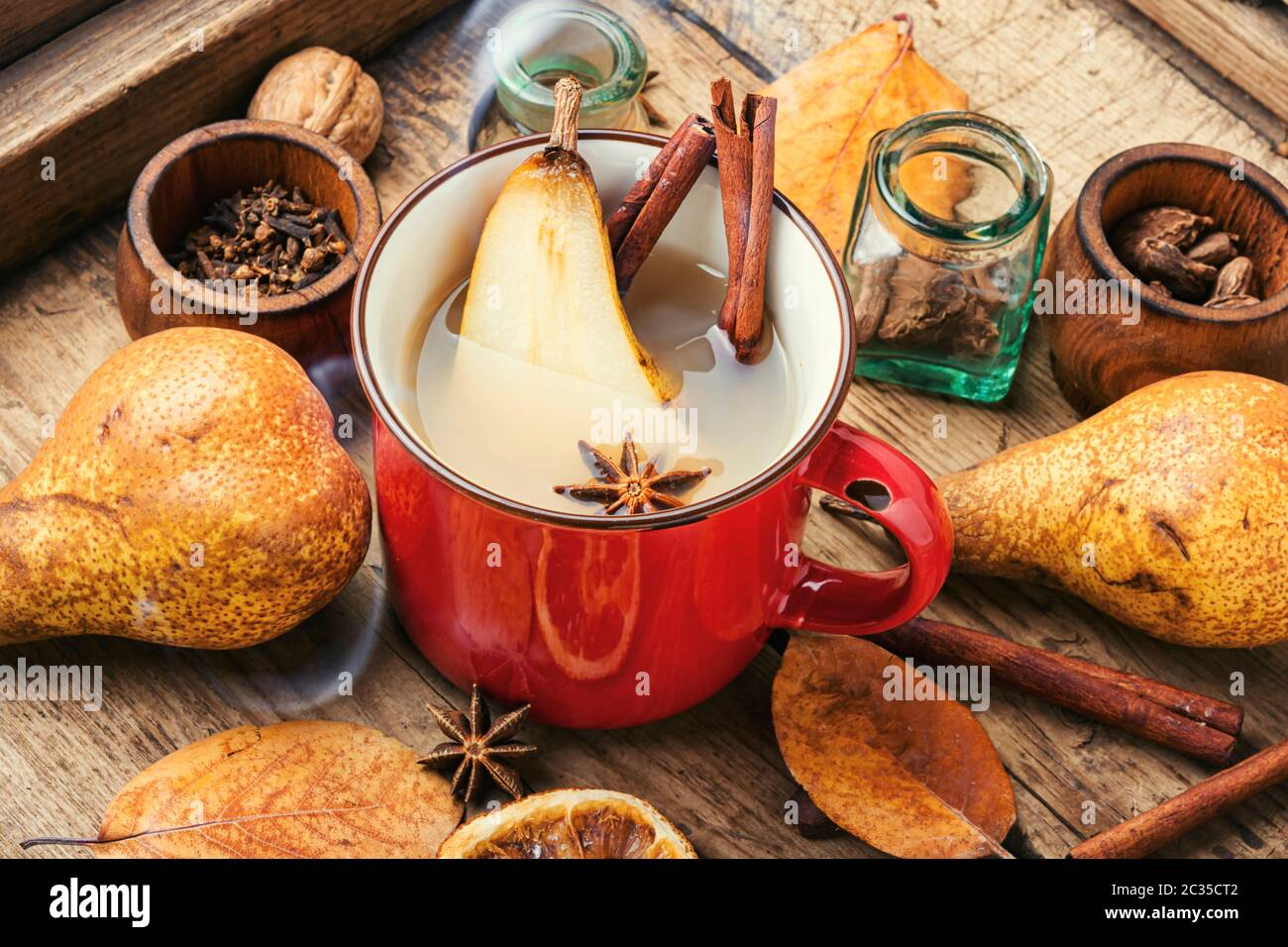 Traditional autumn alcoholic drink.Warm pear mulled wine.Pear wine with ...