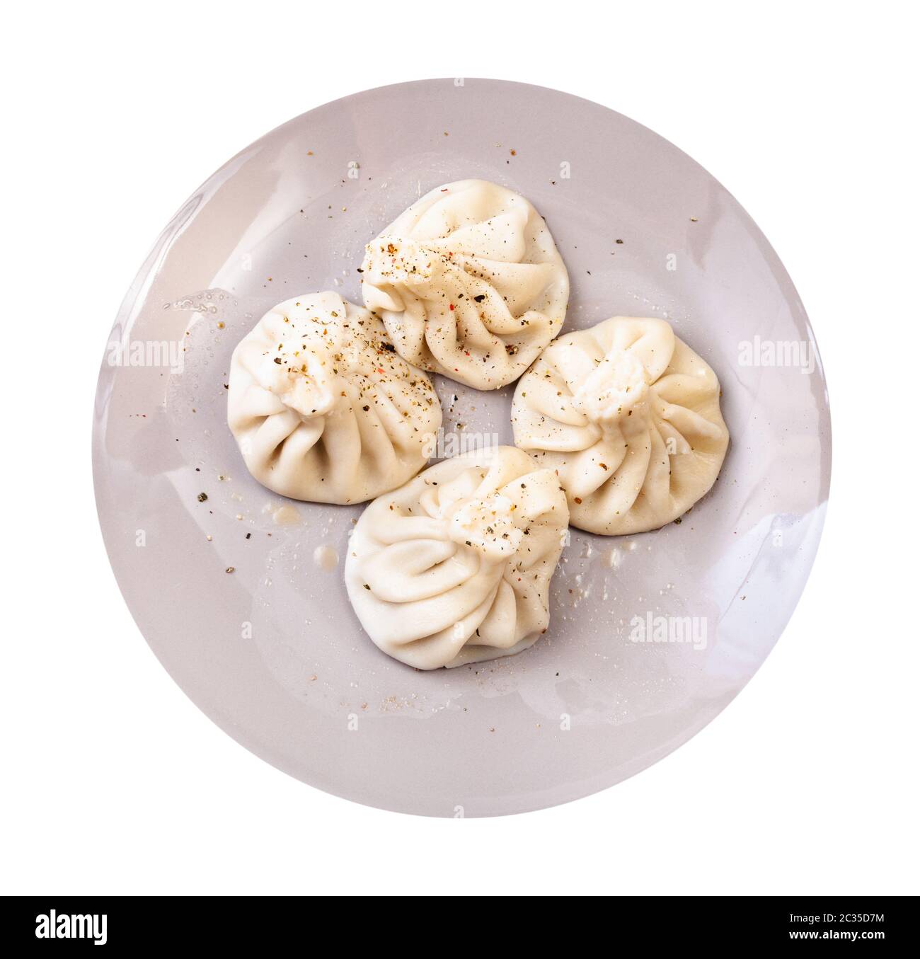 georgian cuisine - top view of cooked khinkali on gray plate isolated ...