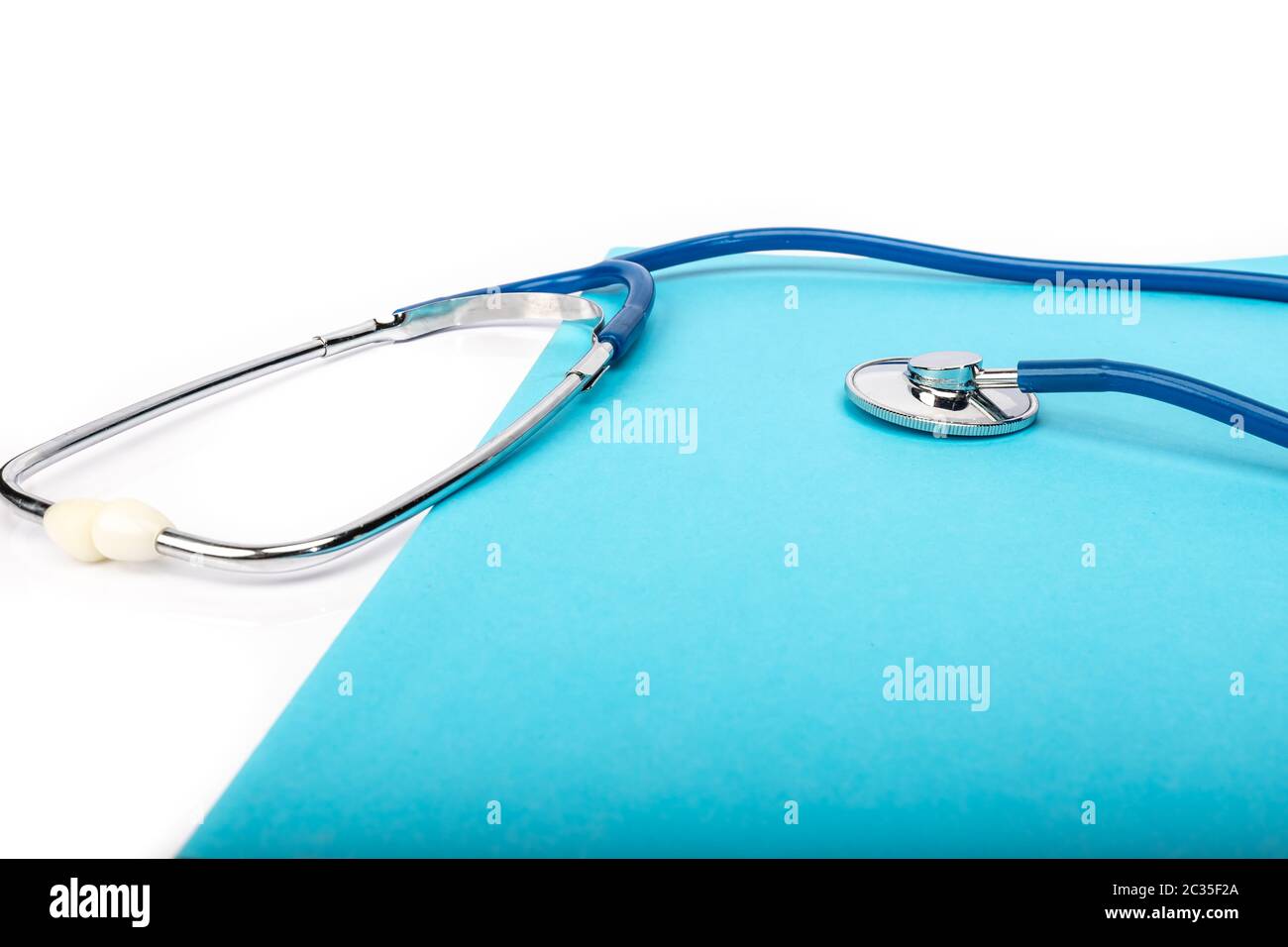 medical record and blue stethoscope close-up on white background in ...