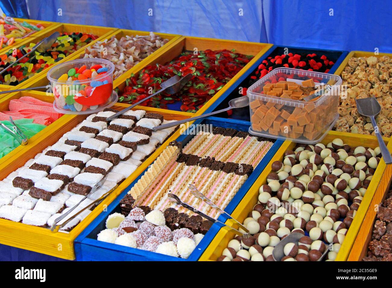 Big assortment of sweets in individual boxes Stock Photo - Alamy